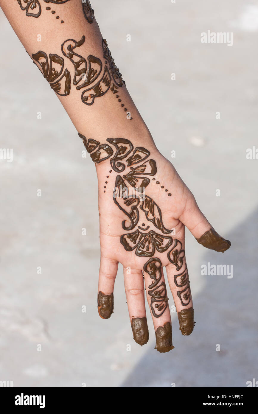 Indian girls with mehndi on hands.Mehndi is the application of henna as ...