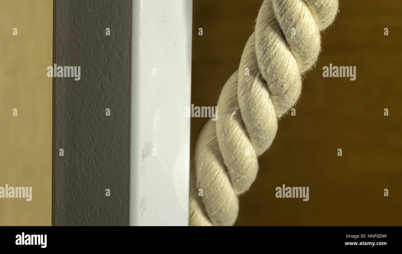 A thick rope and a metal pipe close-up Stock Photo - Alamy