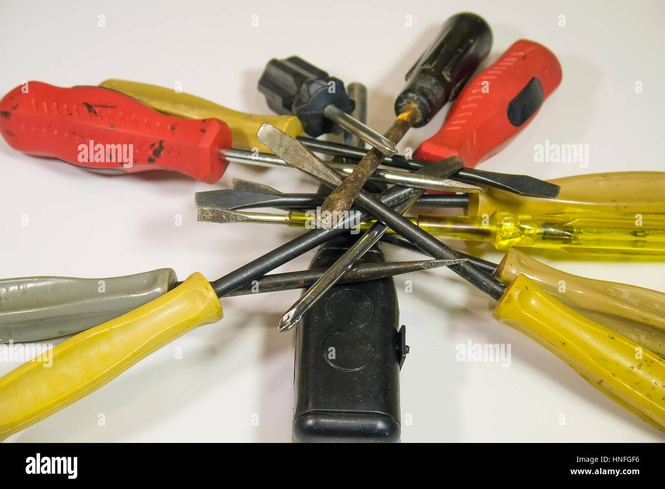 An old colorful screwdrivers on a white background closeup Stock Photo ...