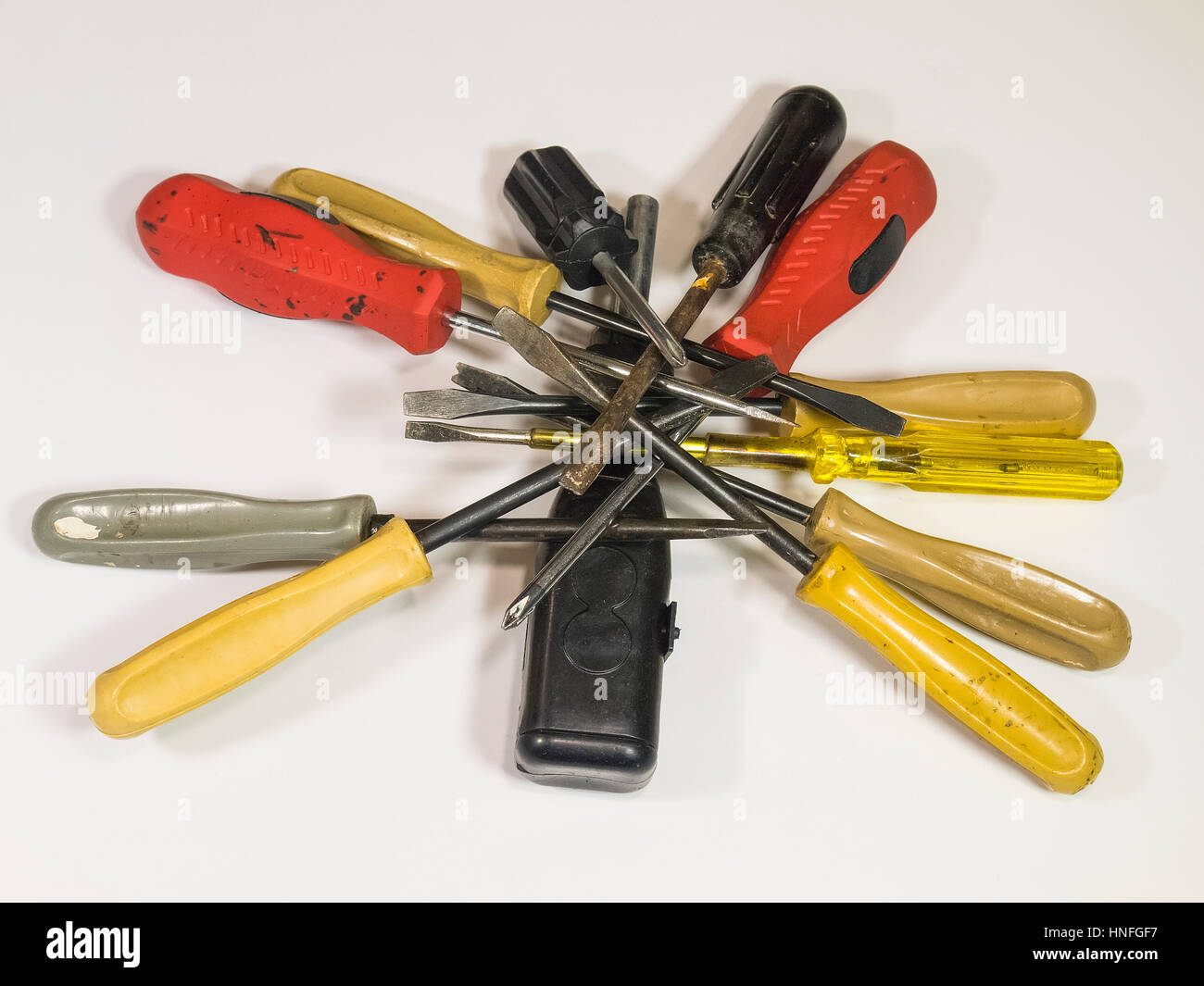 An old colorful screwdrivers on a white background Stock Photo - Alamy