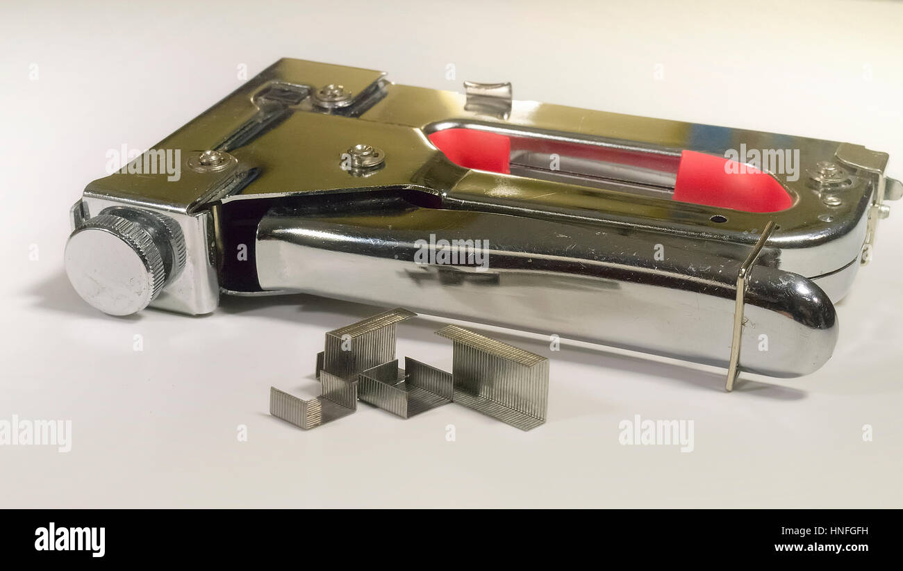 The staple gun on isolated white background Stock Photo - Alamy