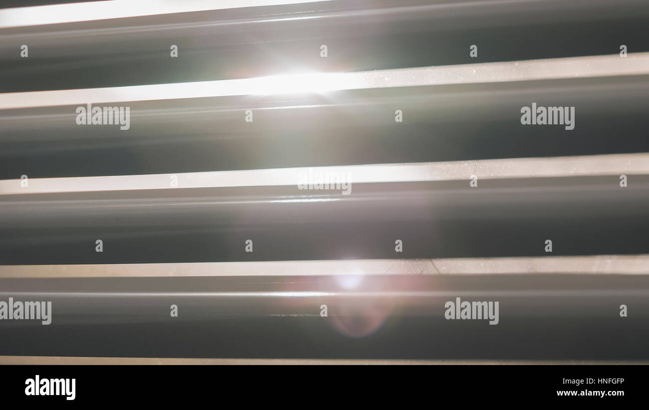 The sun lights shining through the blinds Stock Photo - Alamy