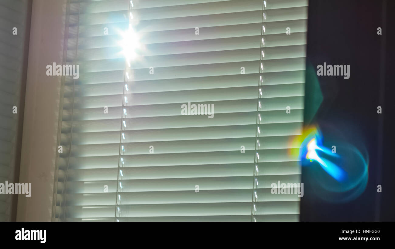 Sun rays through blinds hi-res stock photography and images - Alamy