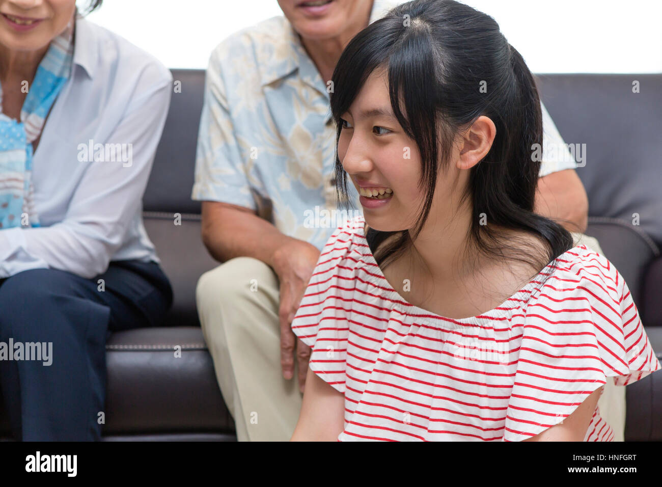 Family member enjoying conversation Stock Photo - Alamy