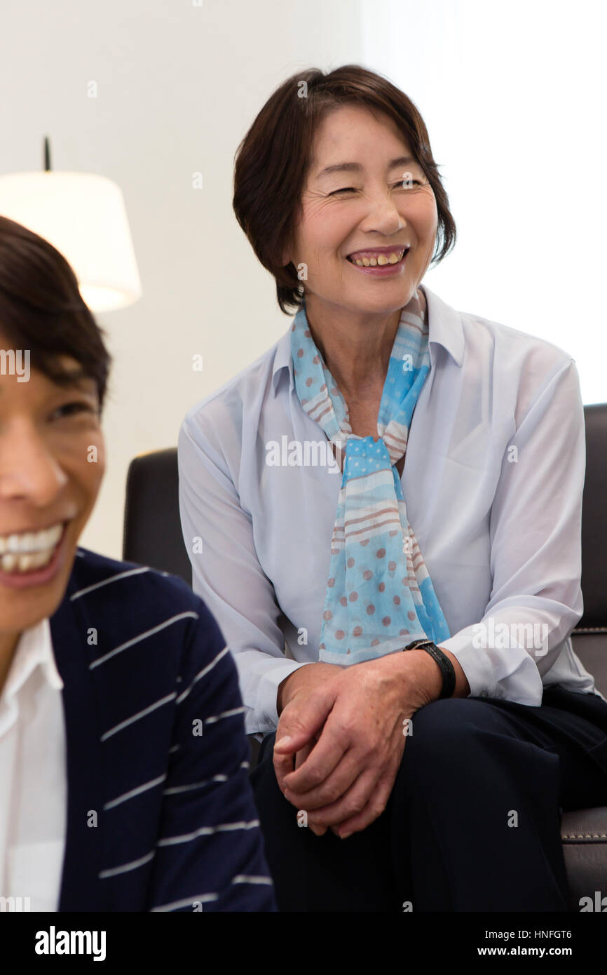 Family member enjoying conversation Stock Photo - Alamy