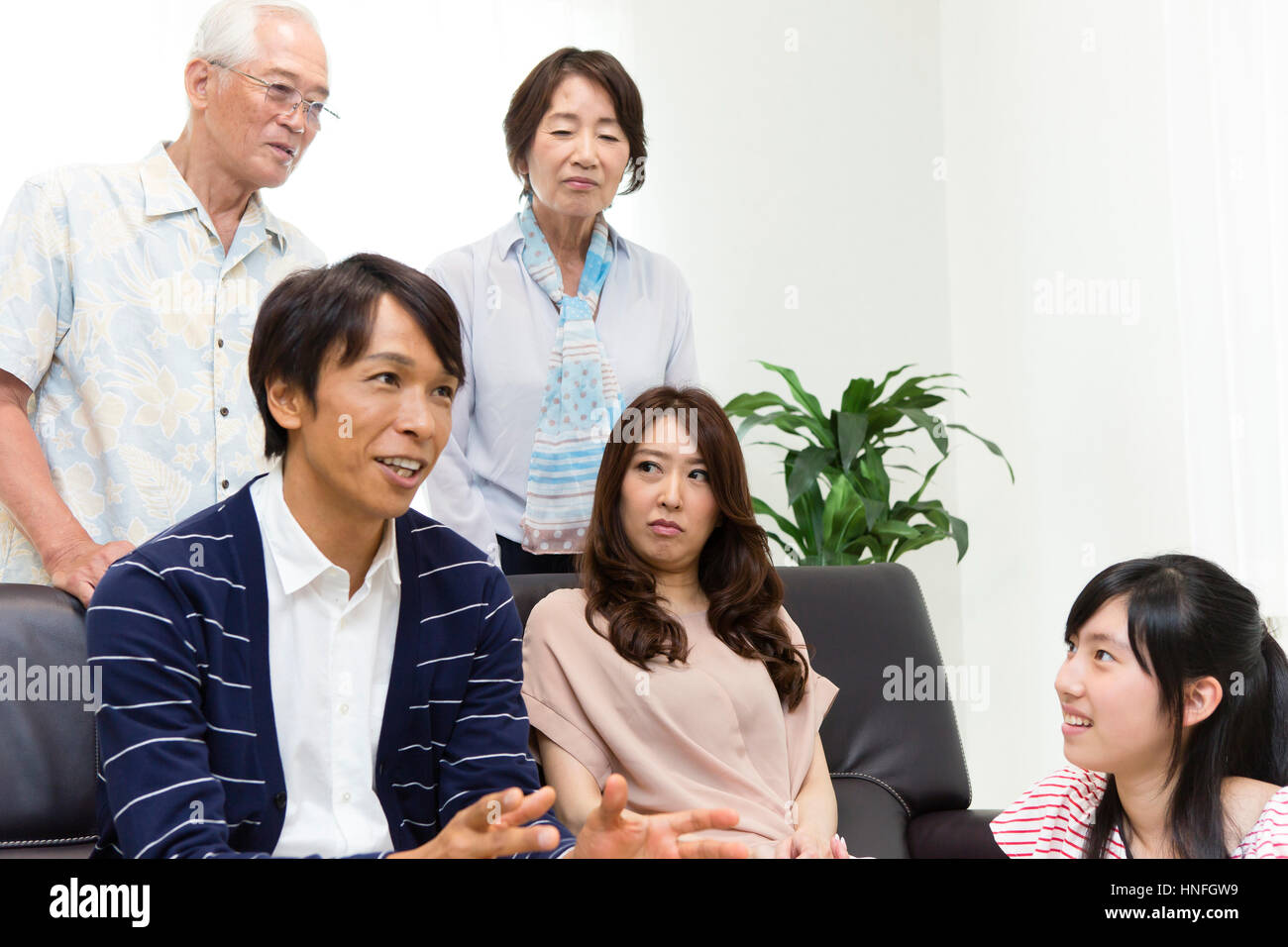 Family member enjoying conversation Stock Photo - Alamy