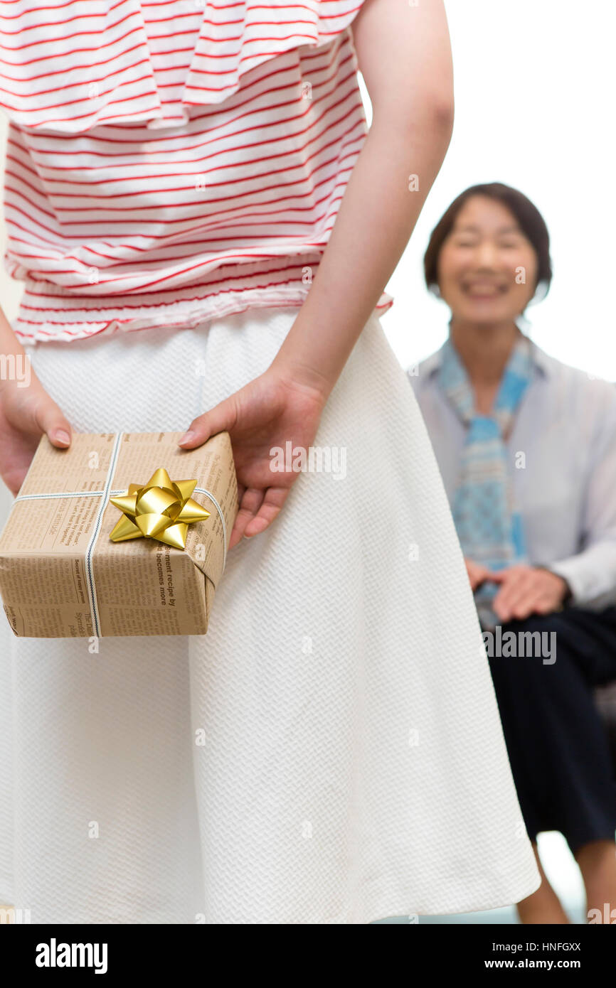 A girl giving her present Stock Photo - Alamy