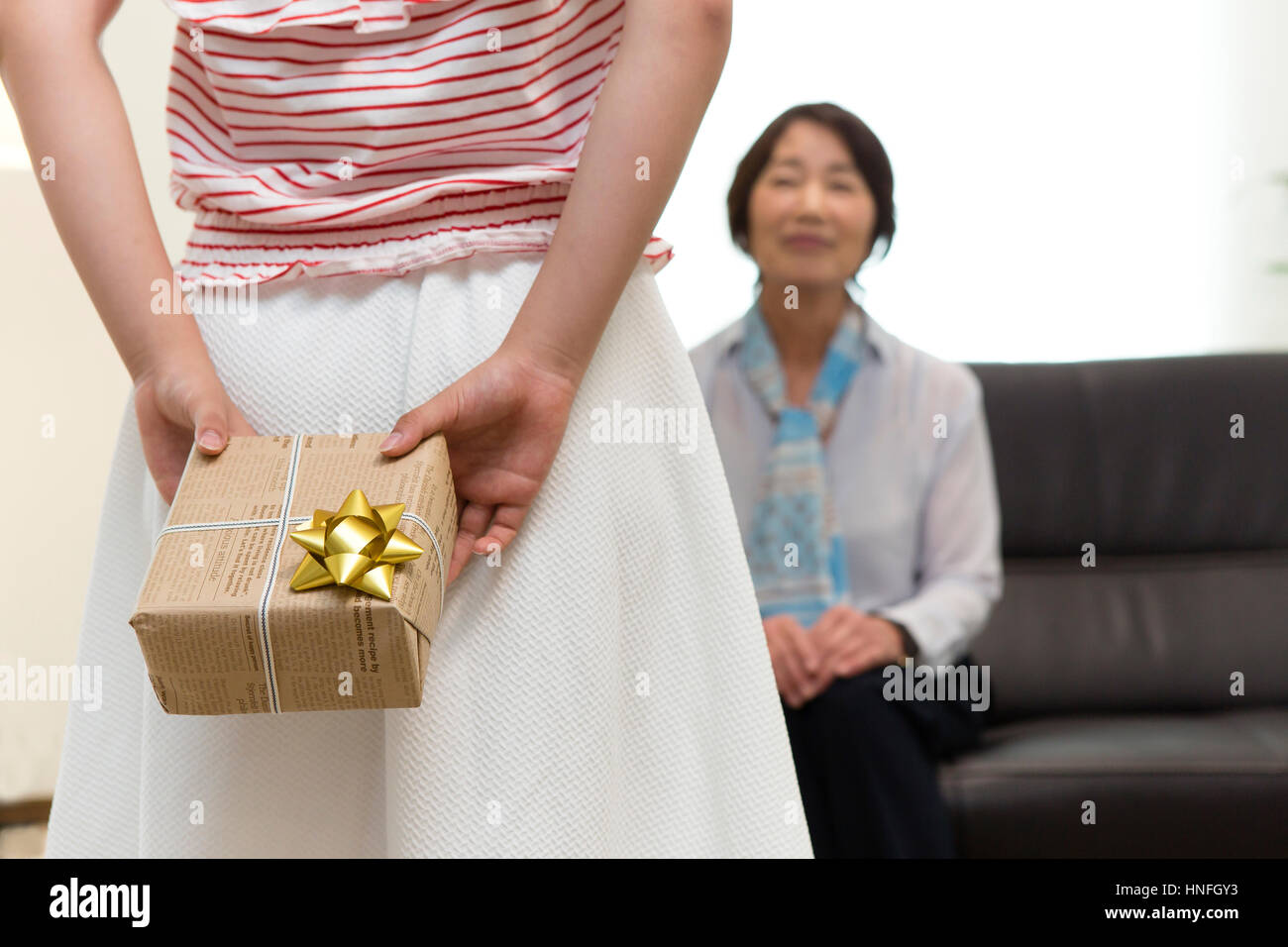 A girl giving her present Stock Photo - Alamy