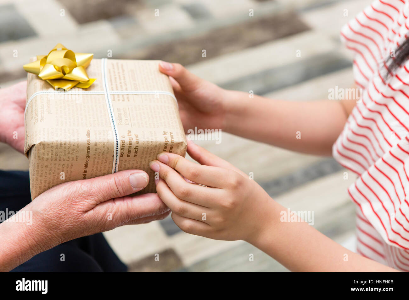 A girl giving her present Stock Photo - Alamy