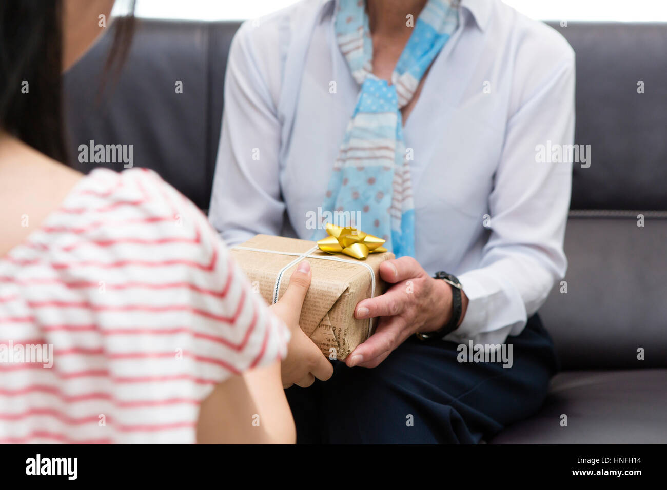 A girl giving her present Stock Photo - Alamy