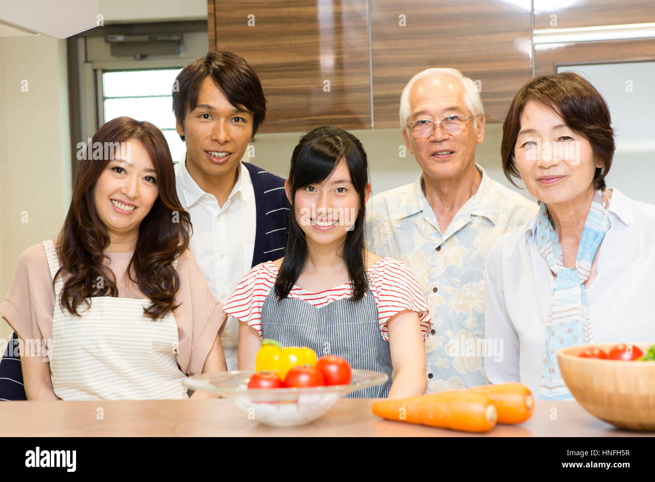 Three generation people in the kitchen Stock Photo - Alamy