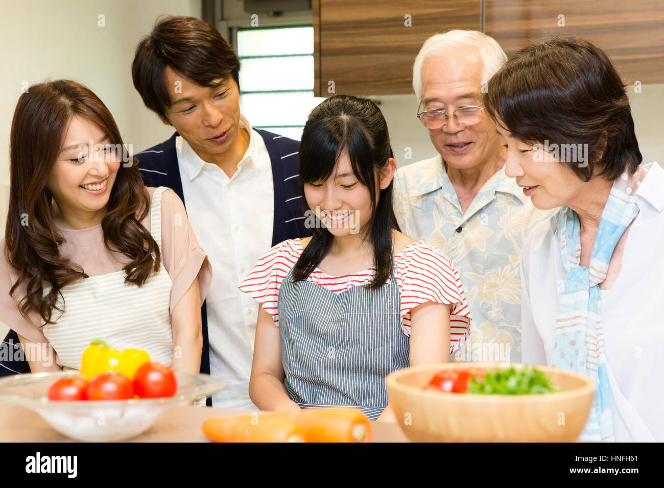 Three generation people in the kitchen Stock Photo - Alamy
