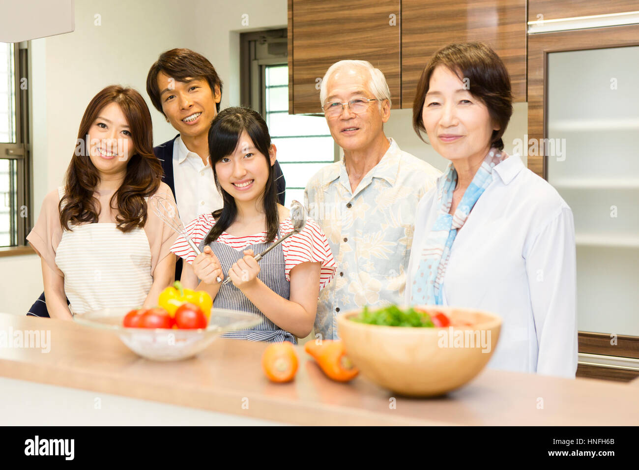 Three generation people in the kitchen Stock Photo - Alamy