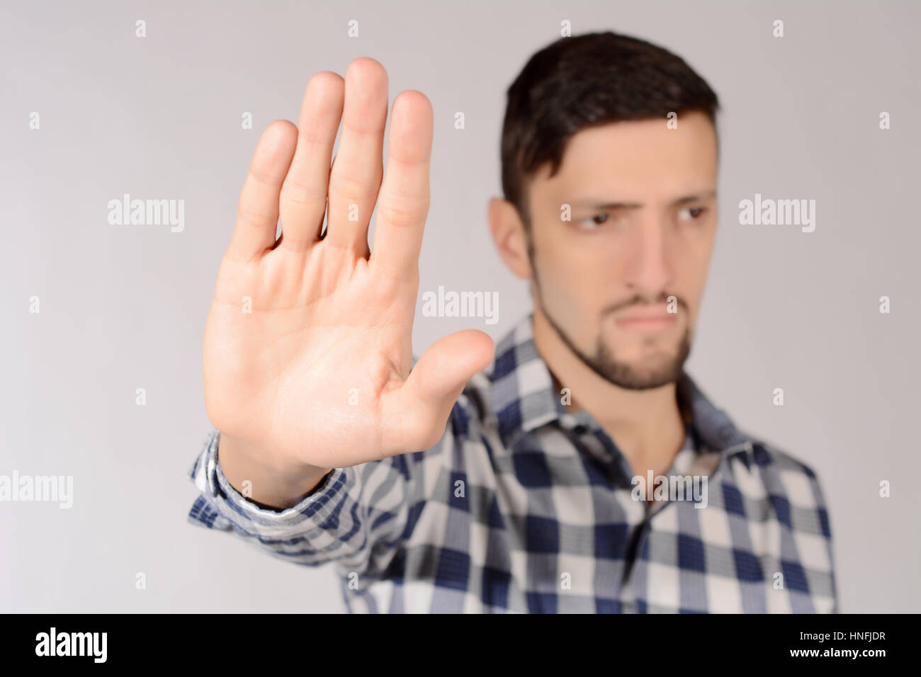 Serious hand signal hi-res stock photography and images - Alamy