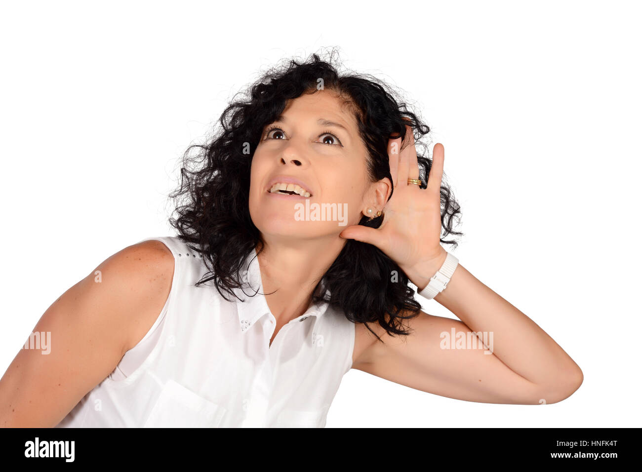 Portrait of beautiful woman hearing something. Isolated white ...