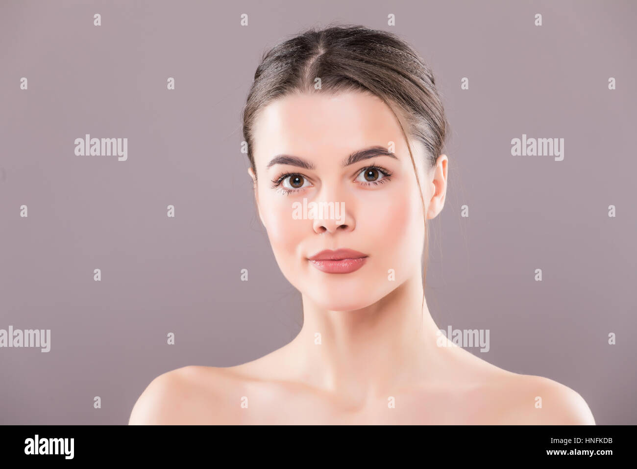 Beautiful Girl face on white. Perfect skin Stock Photo - Alamy