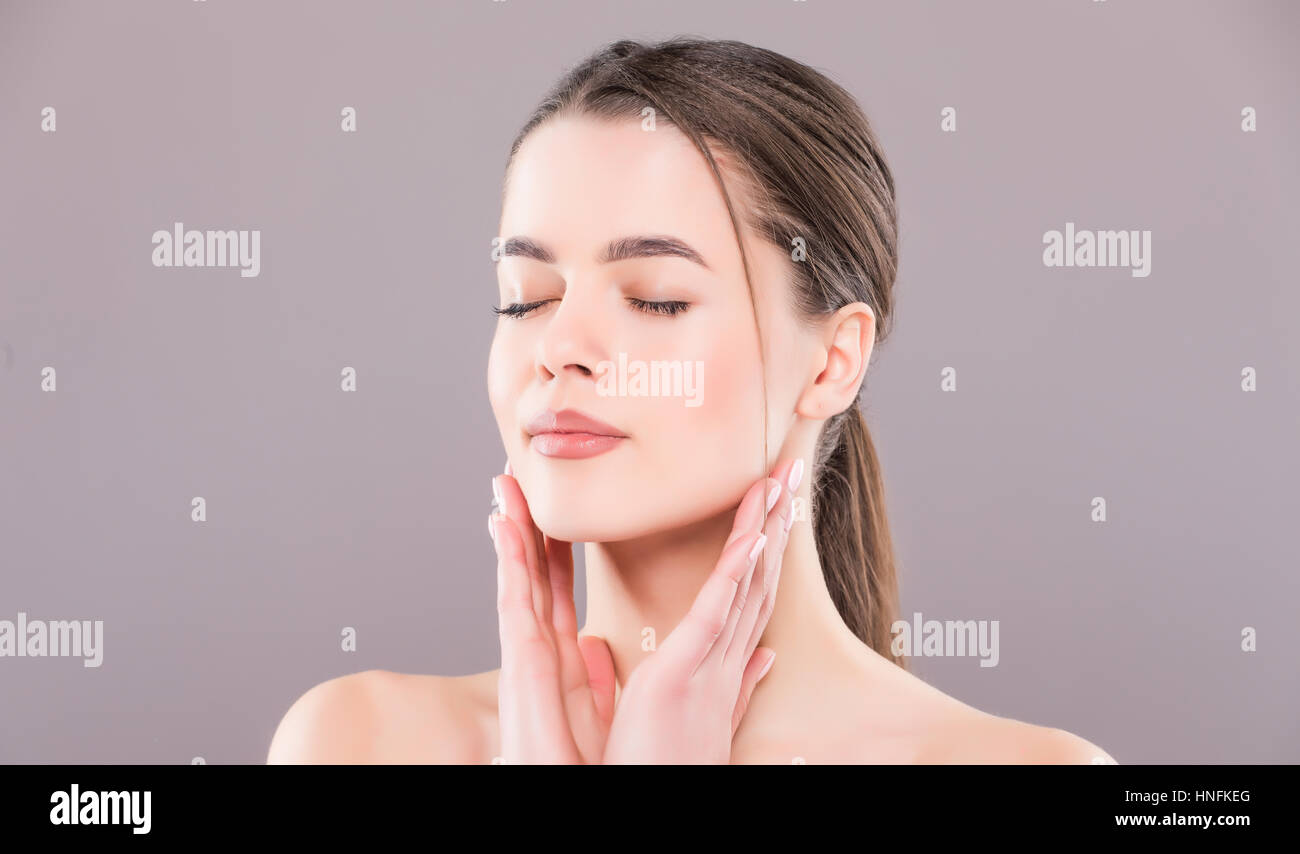 Beautiful Girl face on white. Perfect skin Stock Photo - Alamy