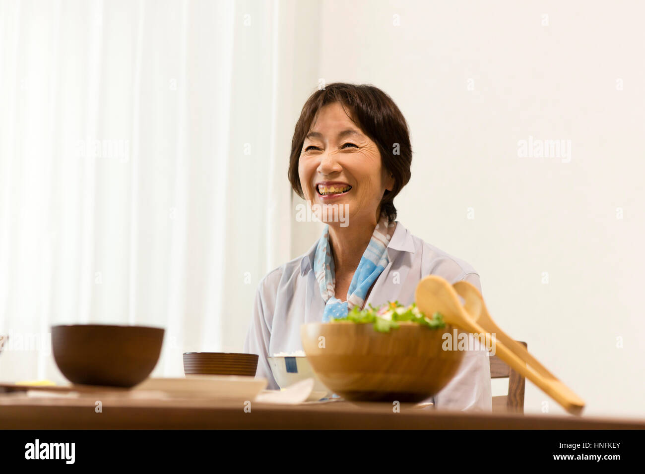 Senior people at a dining table Stock Photo - Alamy
