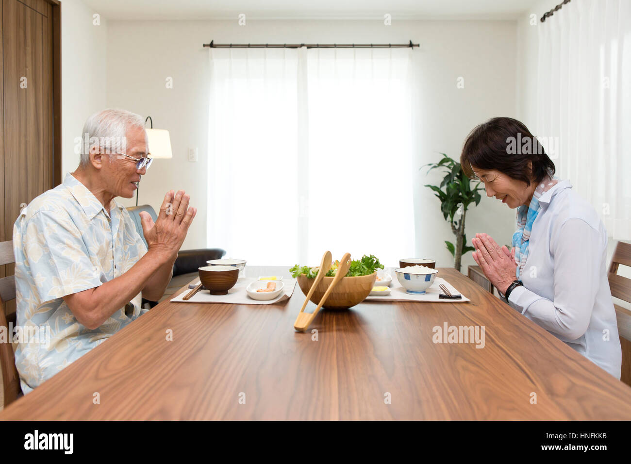 Senior people at a dining table Stock Photo - Alamy