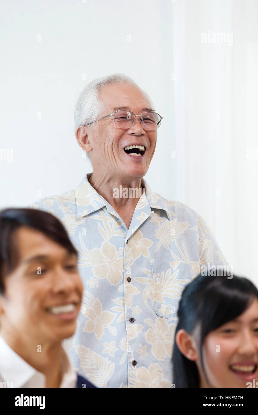 Family member enjoying conversation Stock Photo - Alamy