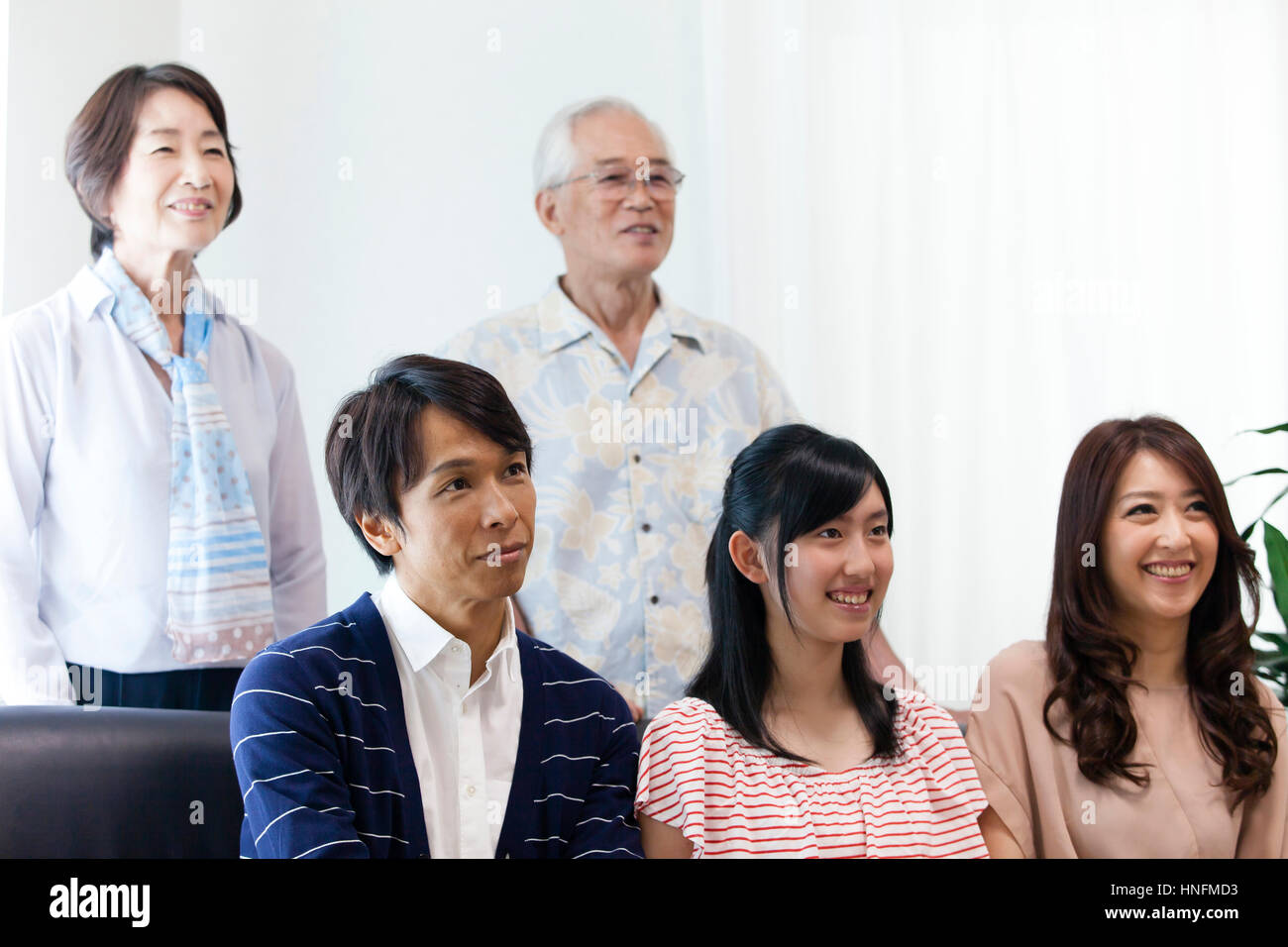 Family member enjoying conversation Stock Photo - Alamy