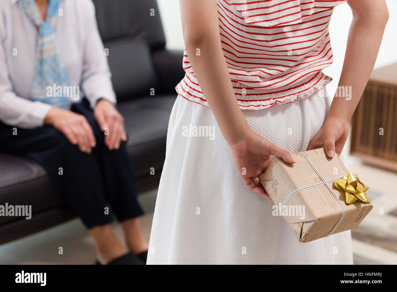 A girl giving her present Stock Photo - Alamy