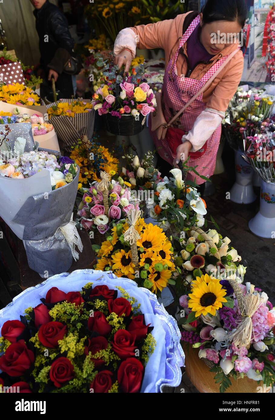 Kunming, China's Yunnan Province. 12th Feb, 2017. A vendor sells ...