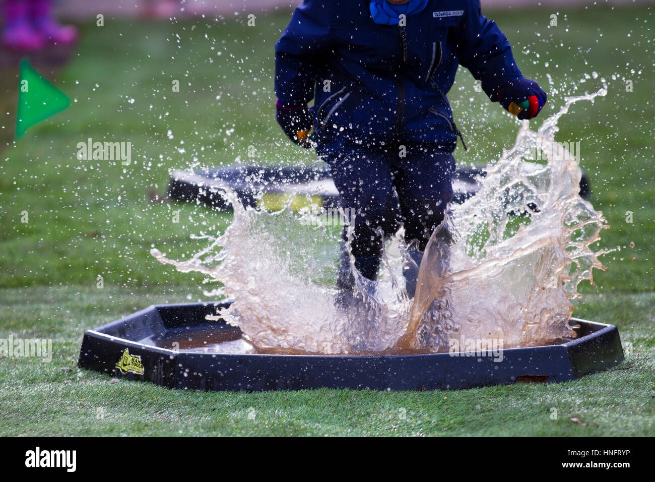 Kids jumping in puddles hi-res stock photography and images - Alamy