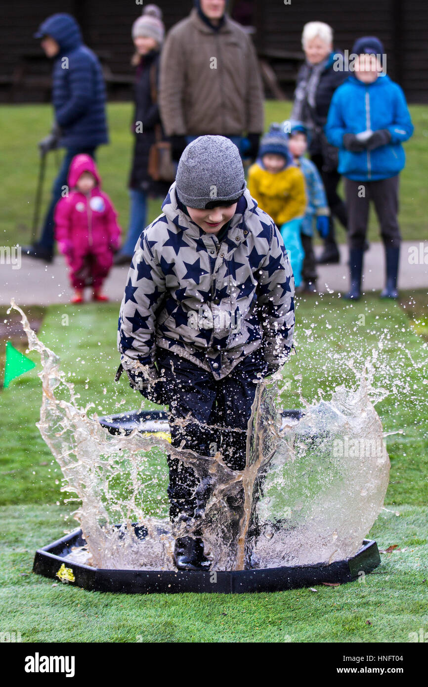 Child jumping in muddy puddle hi-res stock photography and images - Alamy