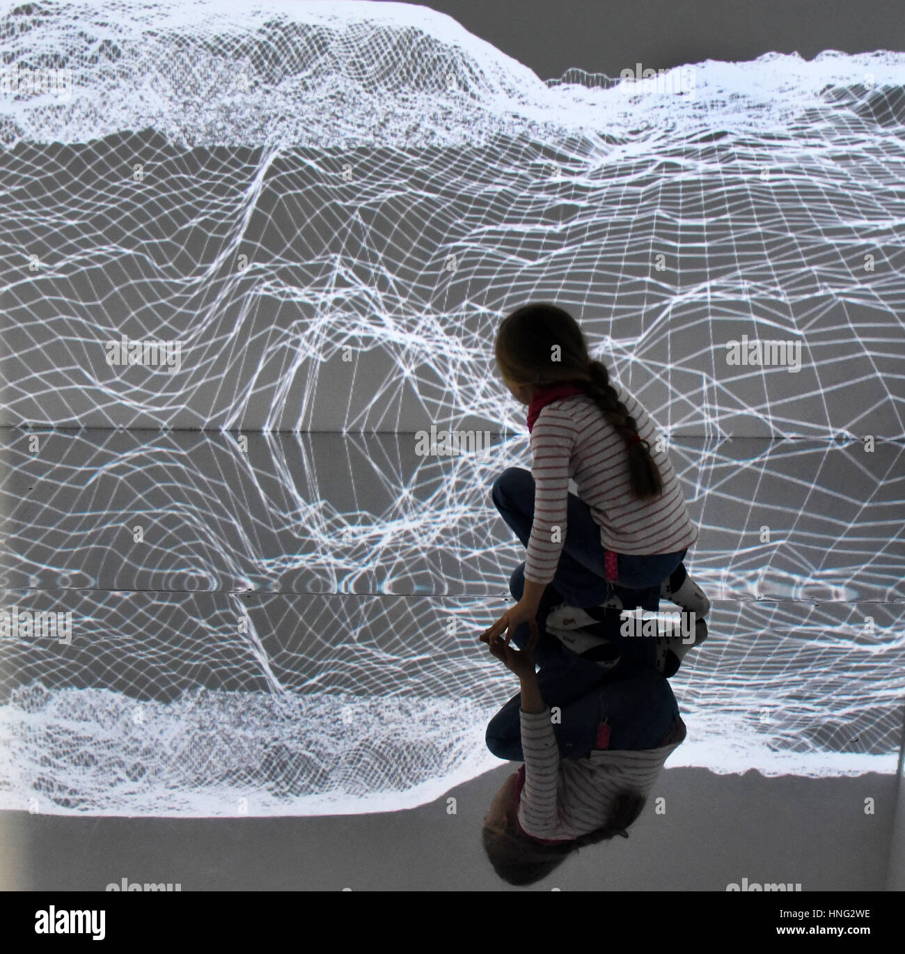 Visitors walk through the interactive and immersive installation of the ...