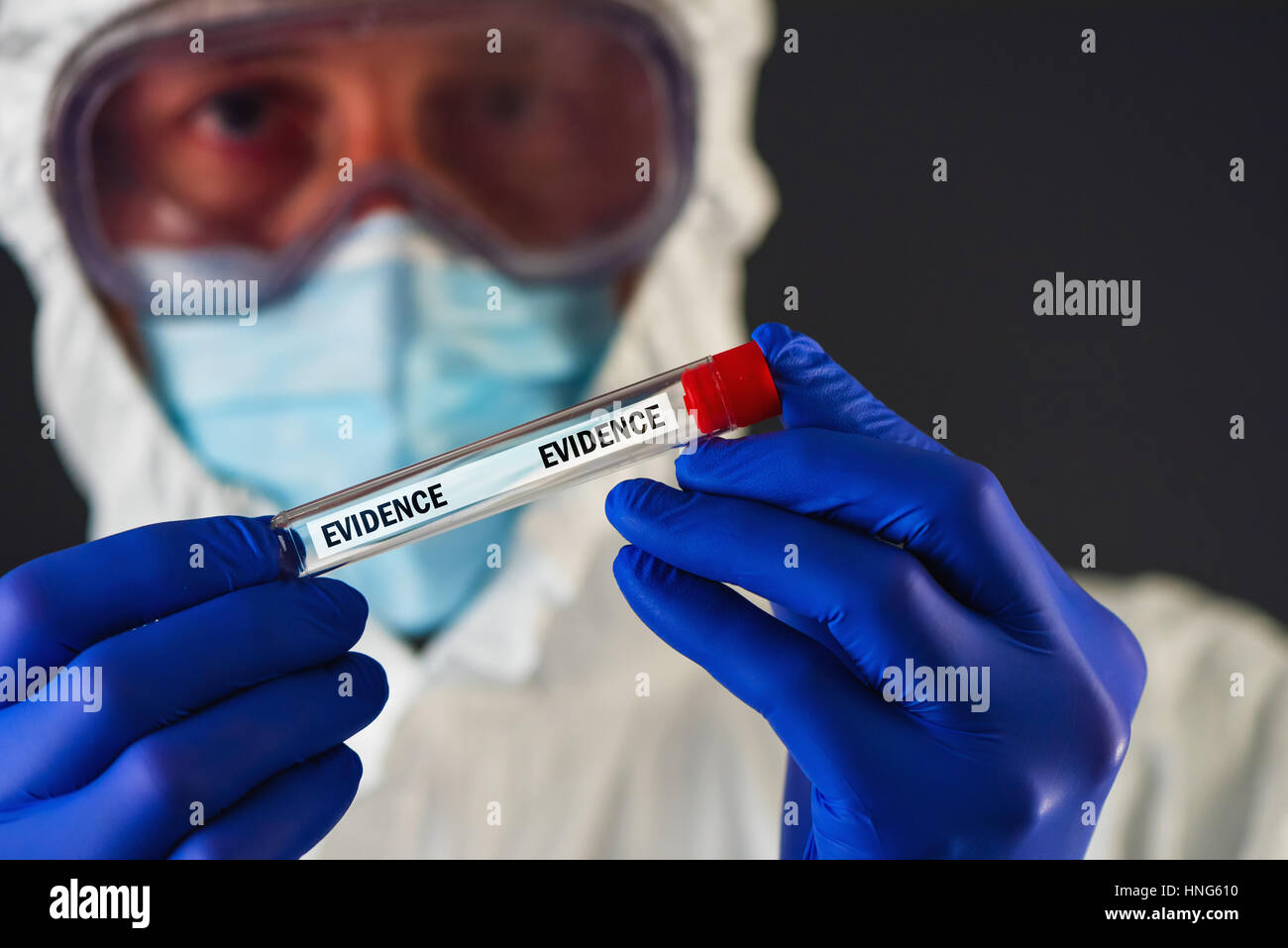 Forensic scientist with evidence tube during crime scene investigation ...