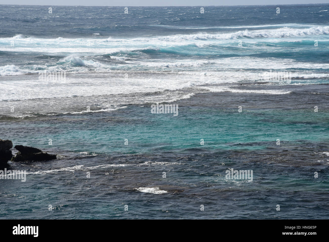 Turquoise Indian Ocean waves rolling in by Cathedral Rocks point at ...