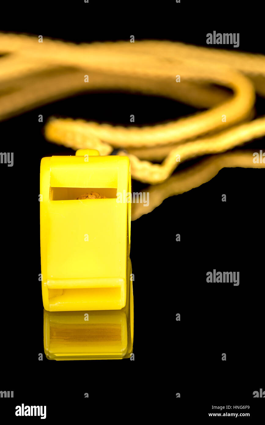 Plastic whistle used in slorts attached to a string Stock Photo - Alamy