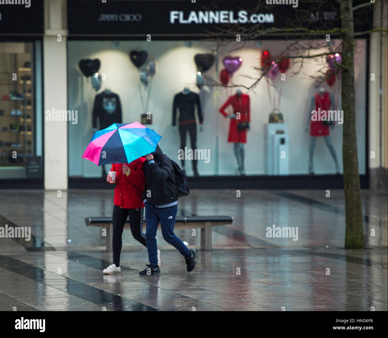 Sheltering from rain hi-res stock photography and images - Alamy