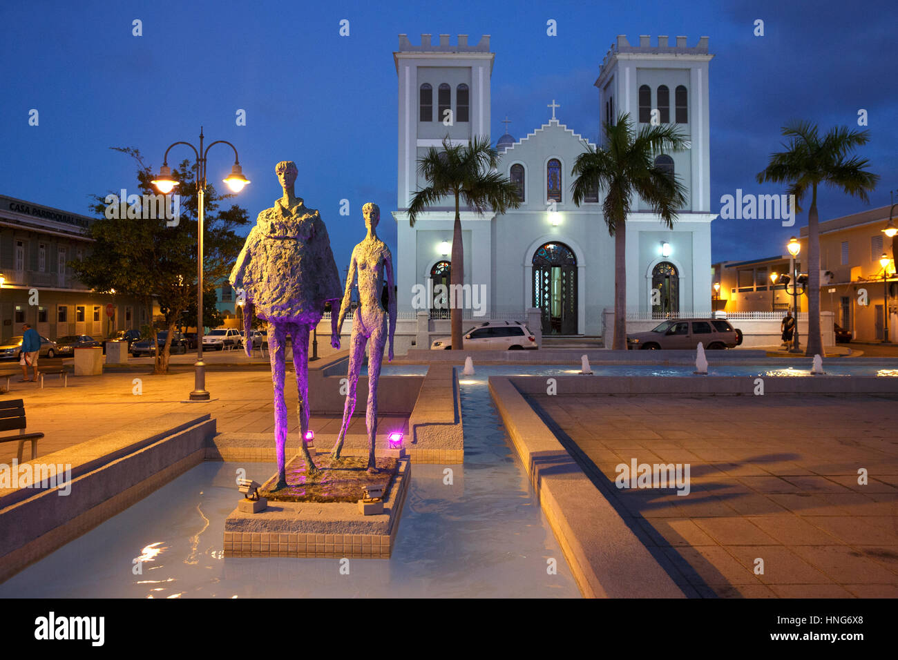 Public sculpture and church in the town square, Isabela, Puerto Rico ...