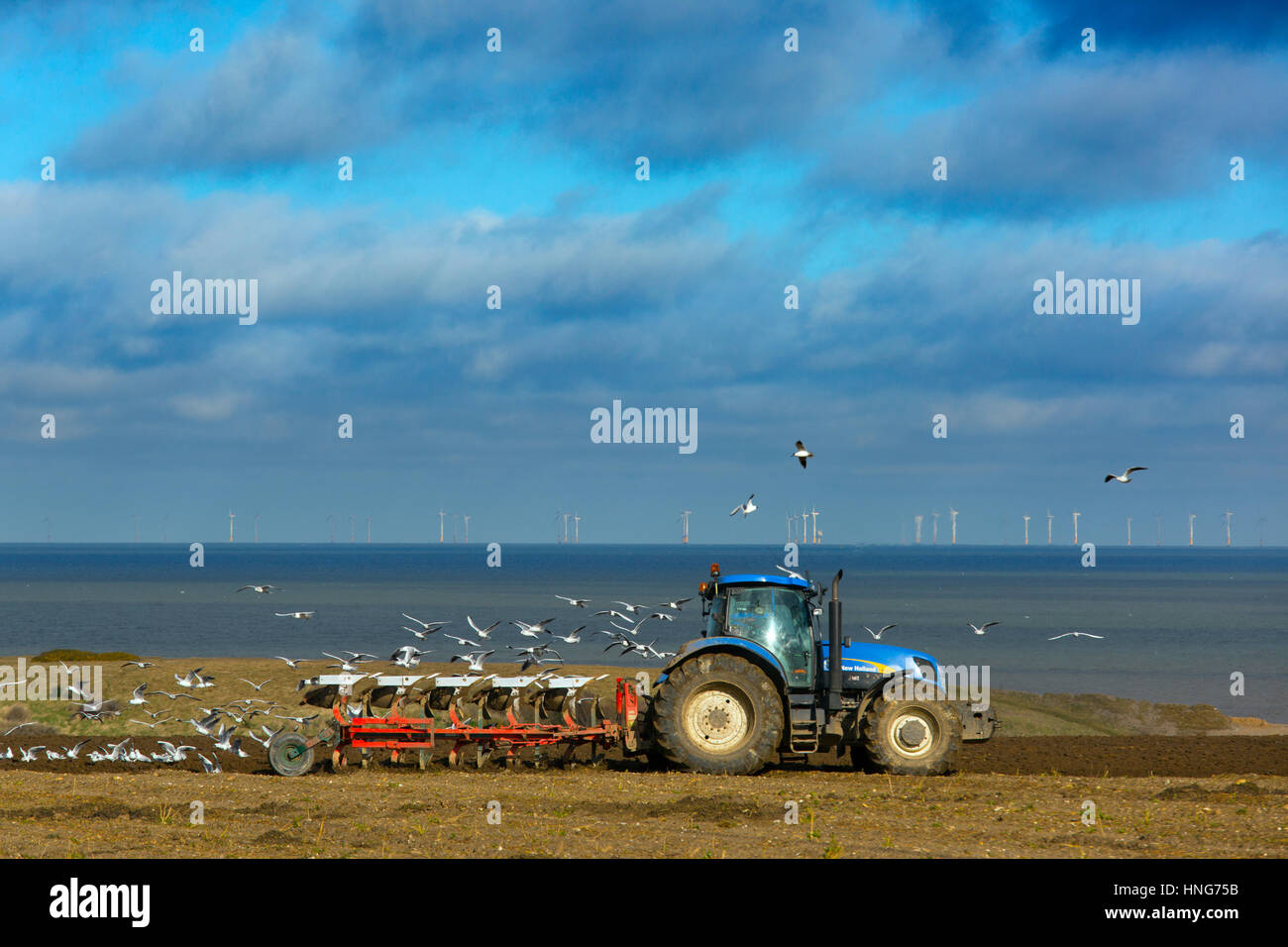 Spring Ploughing near Salthouse with Sheringham Shoal wind farm in the ...