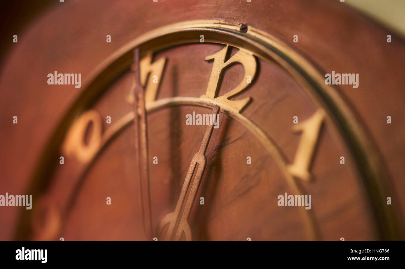 Wooden classic clock with clock needle, five for twelve Stock Photo - Alamy