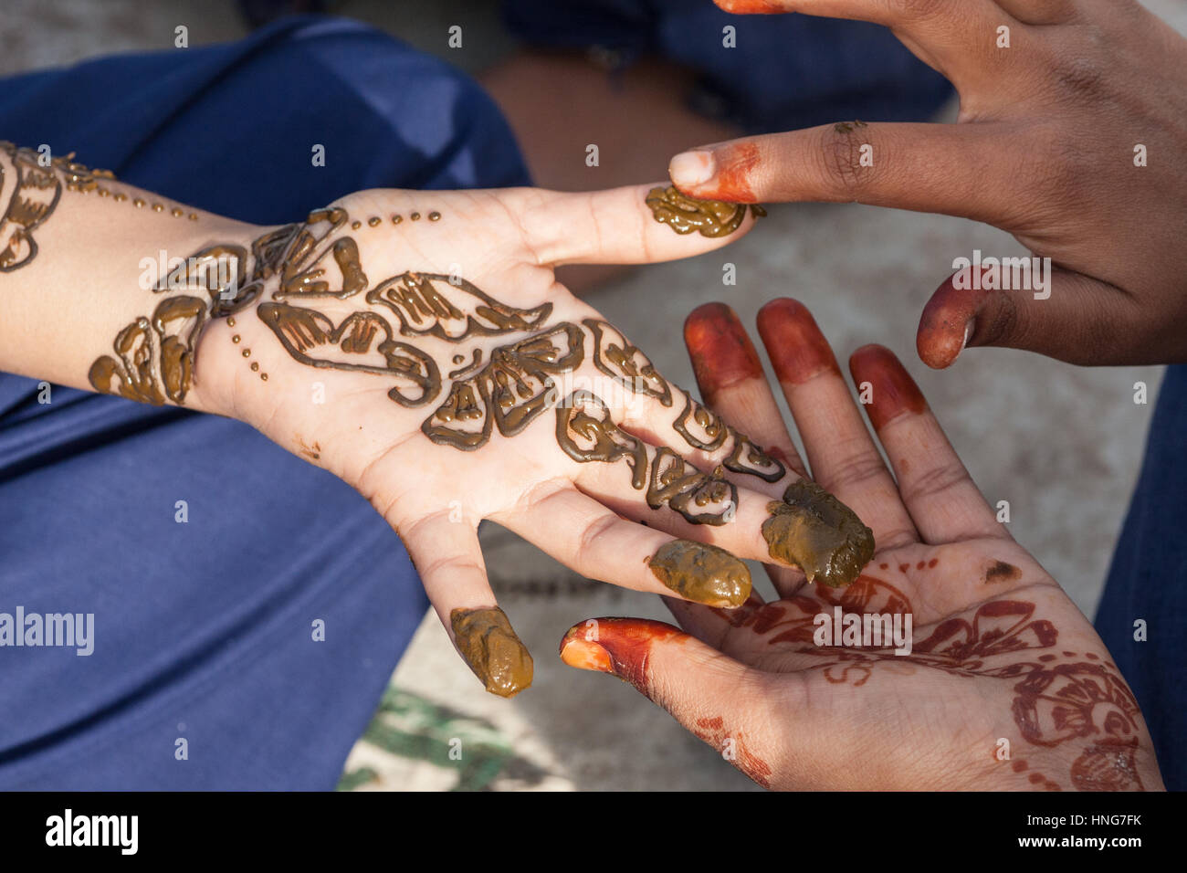 Indian girls with mehndi on hands.Mehndi is the application of henna as ...