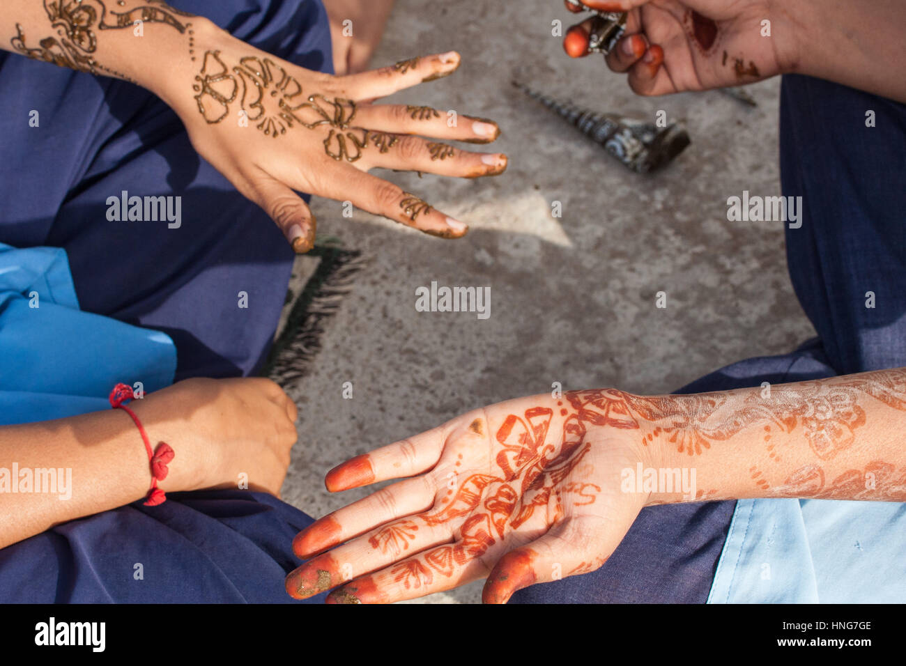 Indian girls with mehndi on hands.Mehndi is the application of henna as ...