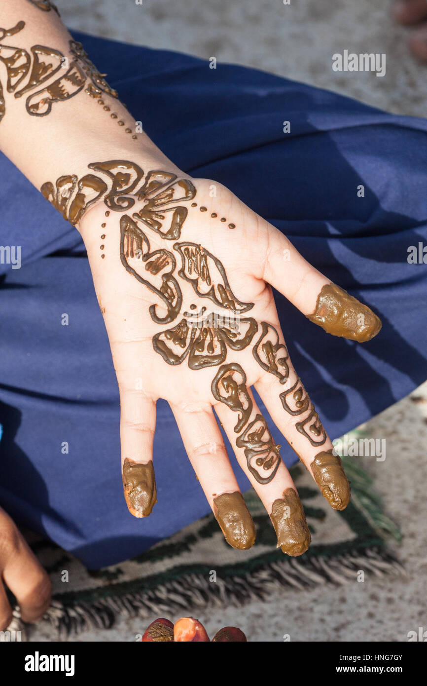 Indian girls with mehndi on hands.Mehndi is the application of henna as ...
