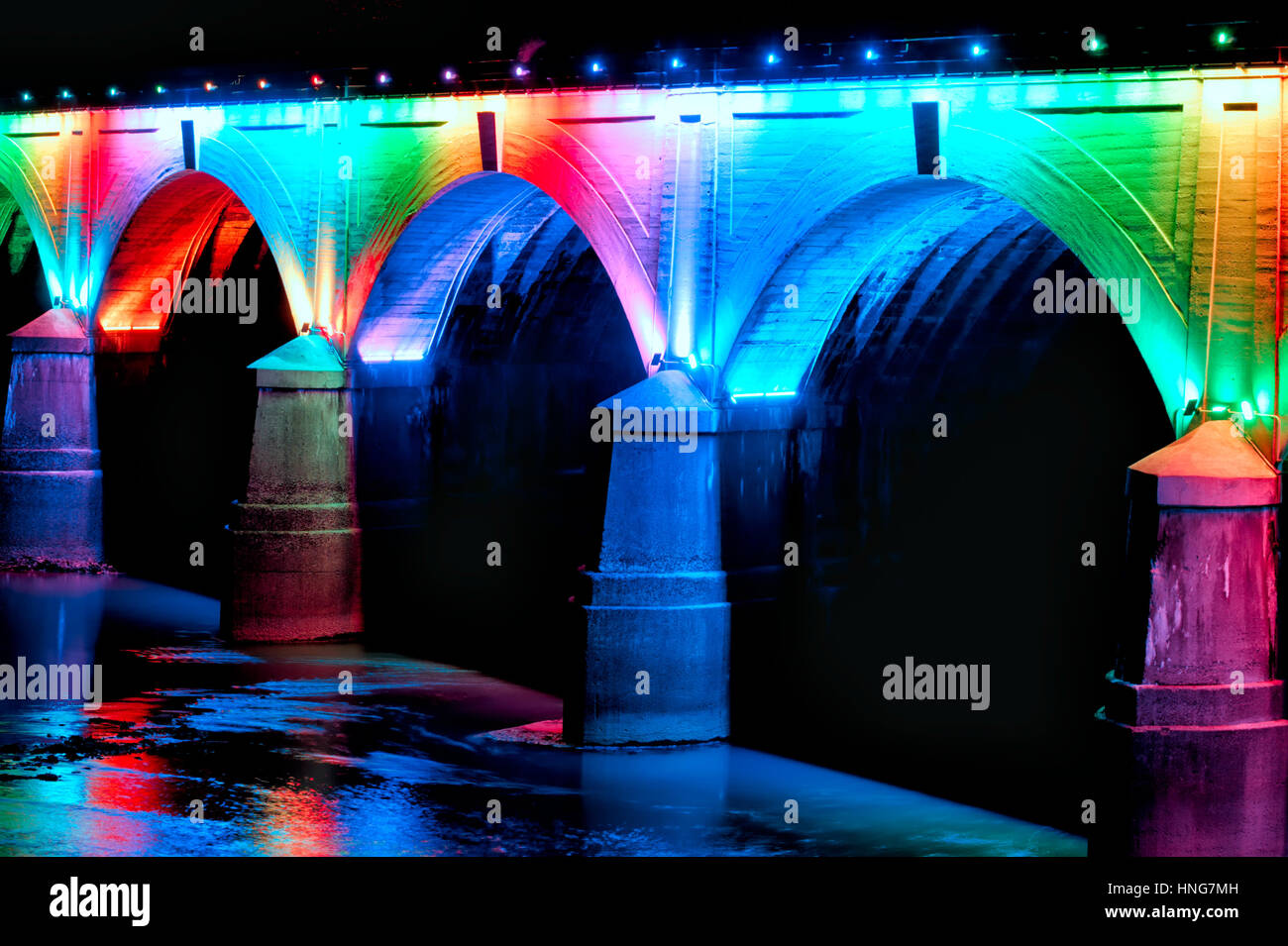 Rainbow bridge illuminated and glowing by colored LED lights and ...