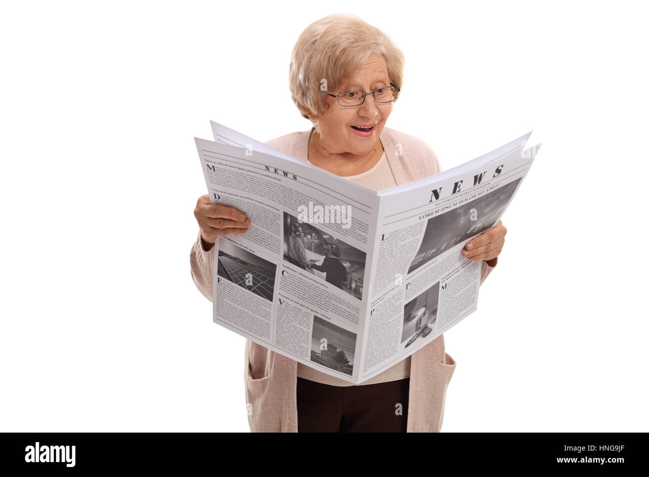 Surprised elderly woman reading a newspaper isolated on white ...