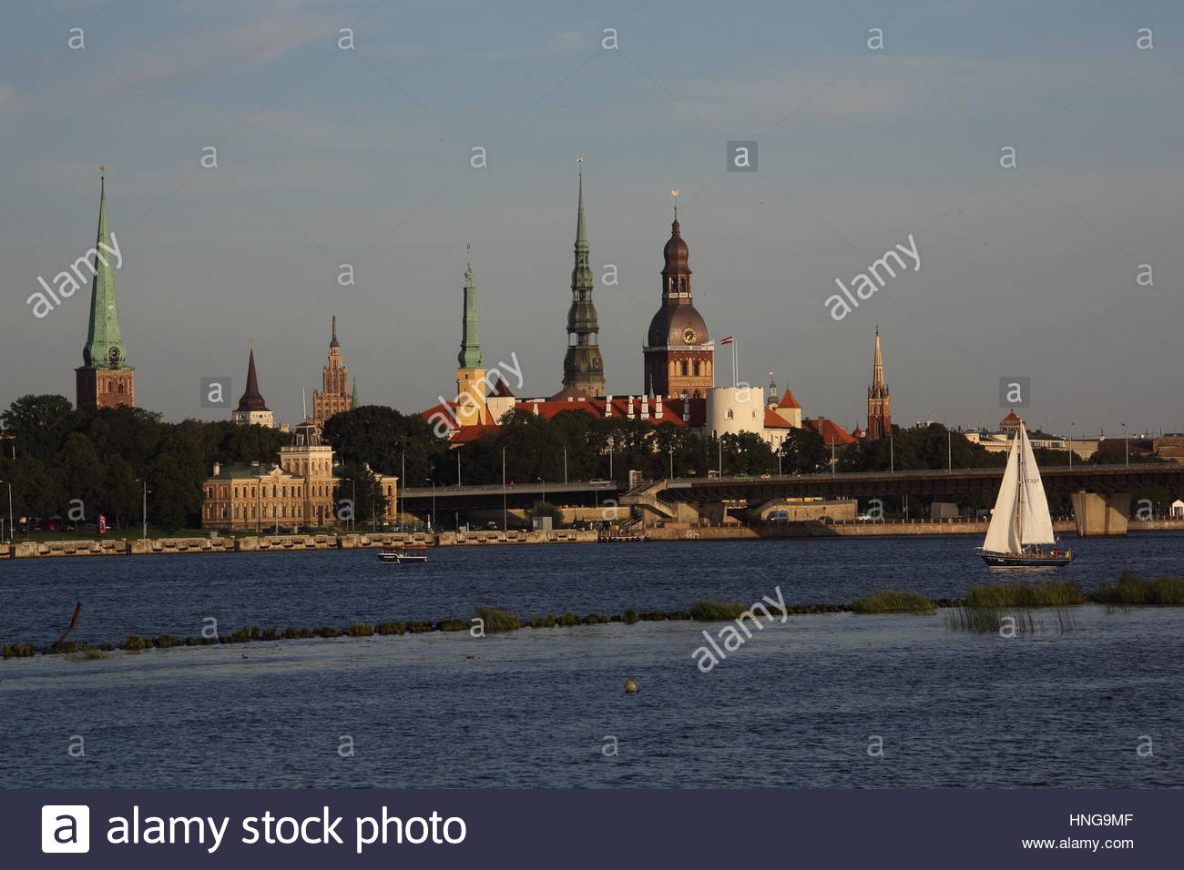 A daytime view of Riga in summer with boats on the river Stock Photo ...