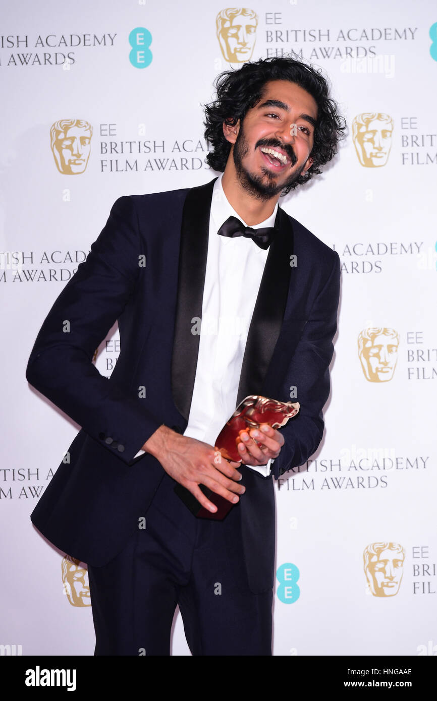 Dev Patel with his award for best Supporting Actor in the press room ...