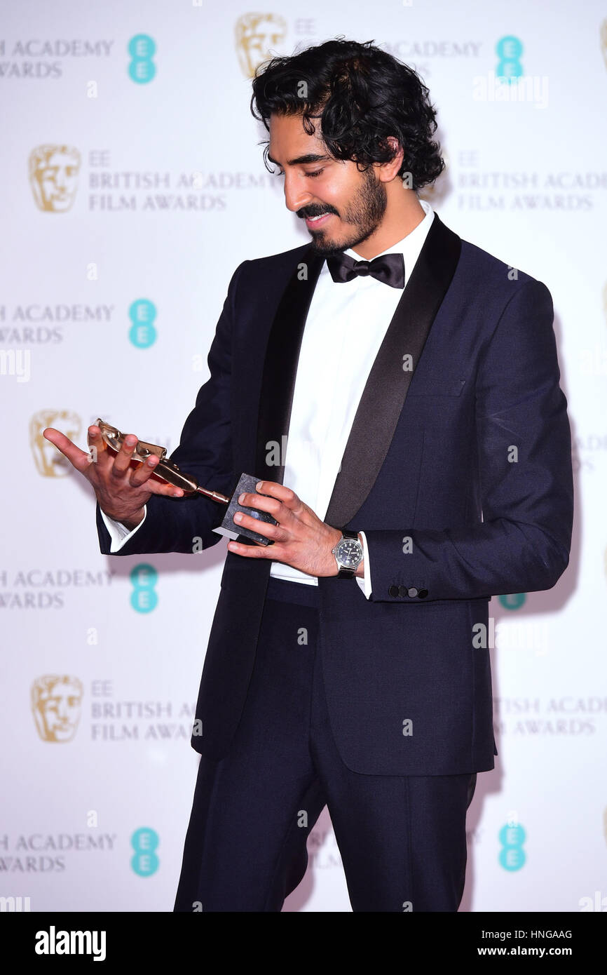 Dev Patel with his award for best Supporting Actor in the press room ...