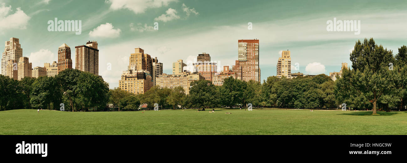 Central Park Spring with skyline in midtown Manhattan New York City ...
