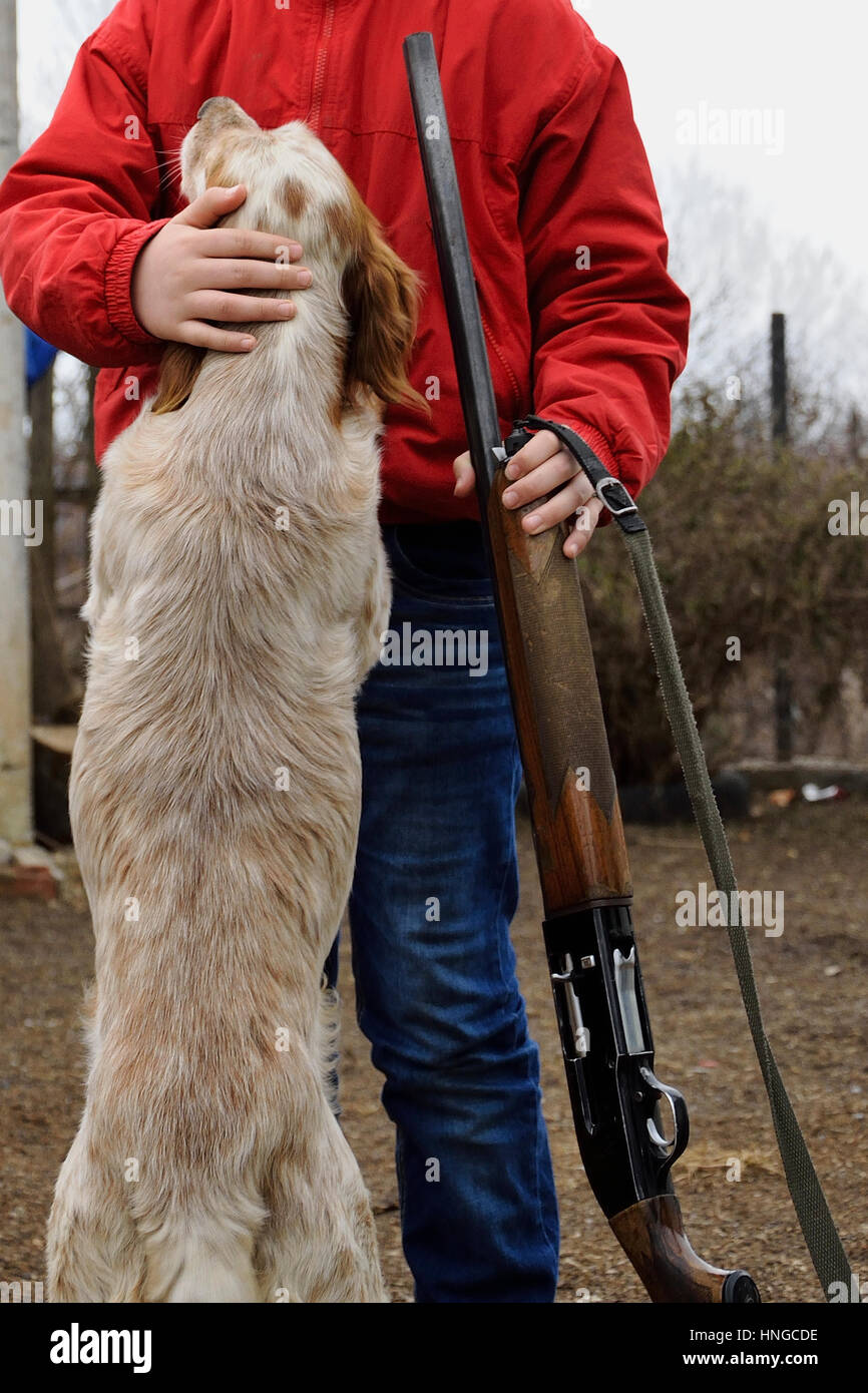 Young boy with a hunting rifle and his hunting setter dog Stock Photo ...