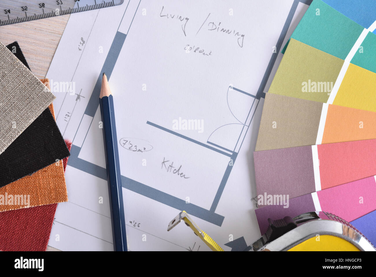 Designer and decorator detail workbench with interior plan of home ...