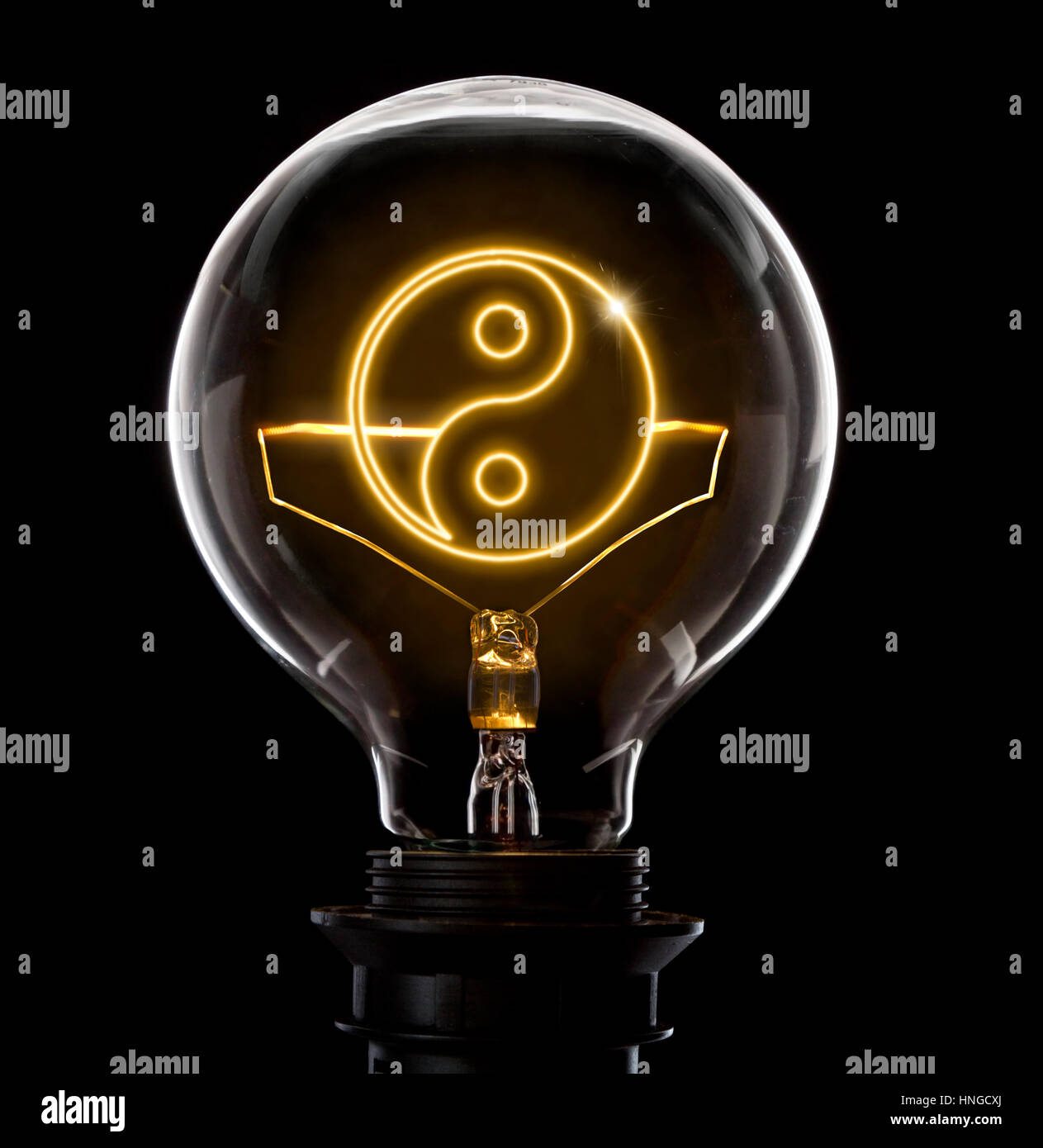 Clean and shiny lightbulb with a Ying Yang symbol as a glowing wire ...
