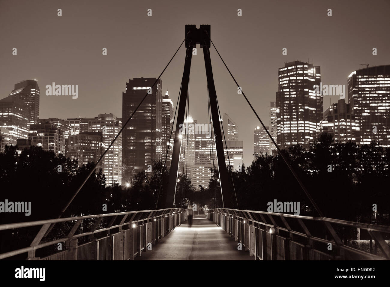 Pedestrian bridge and downtown skyscrapers at hight in Calgary, Canada ...